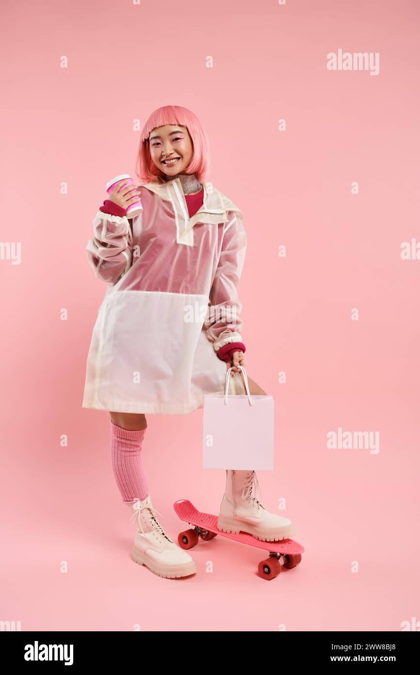 lovely asian woman posing with cup of coffee, shopping packet and ...