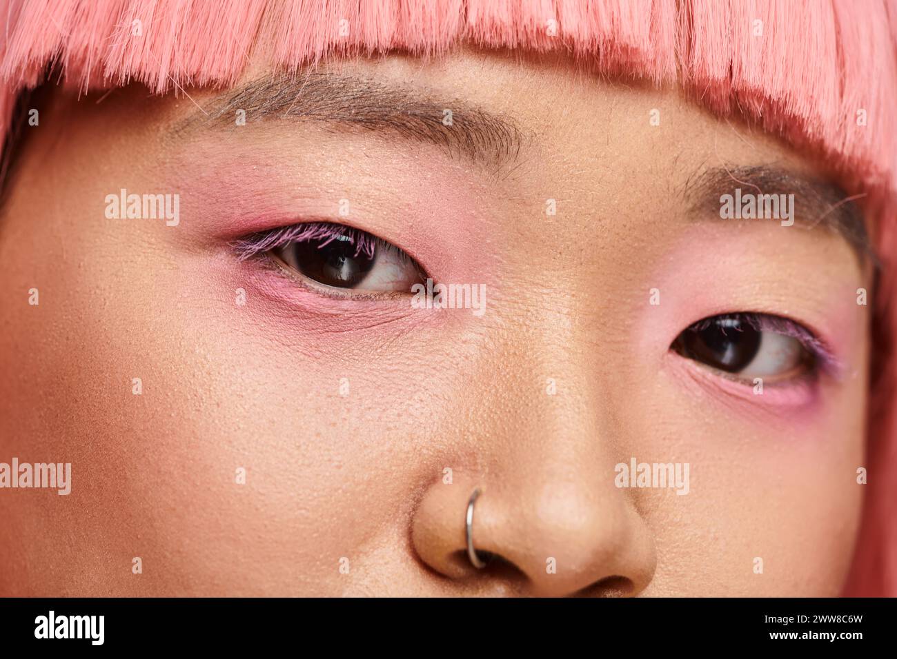 close up of charming asian woman in her 20s with perfect skin, pink ...