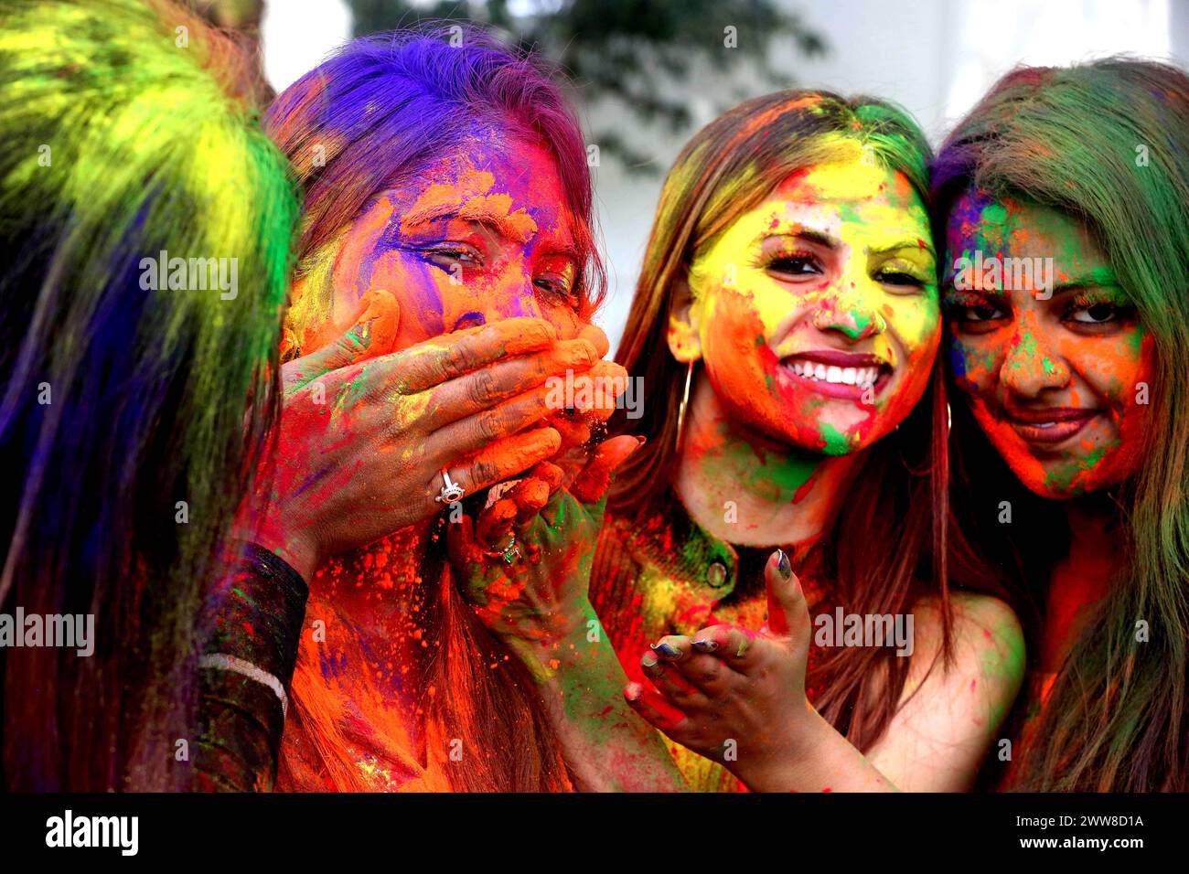 Bhopal, India. 22nd Mar, 2024. Women have their faces smeared with ...