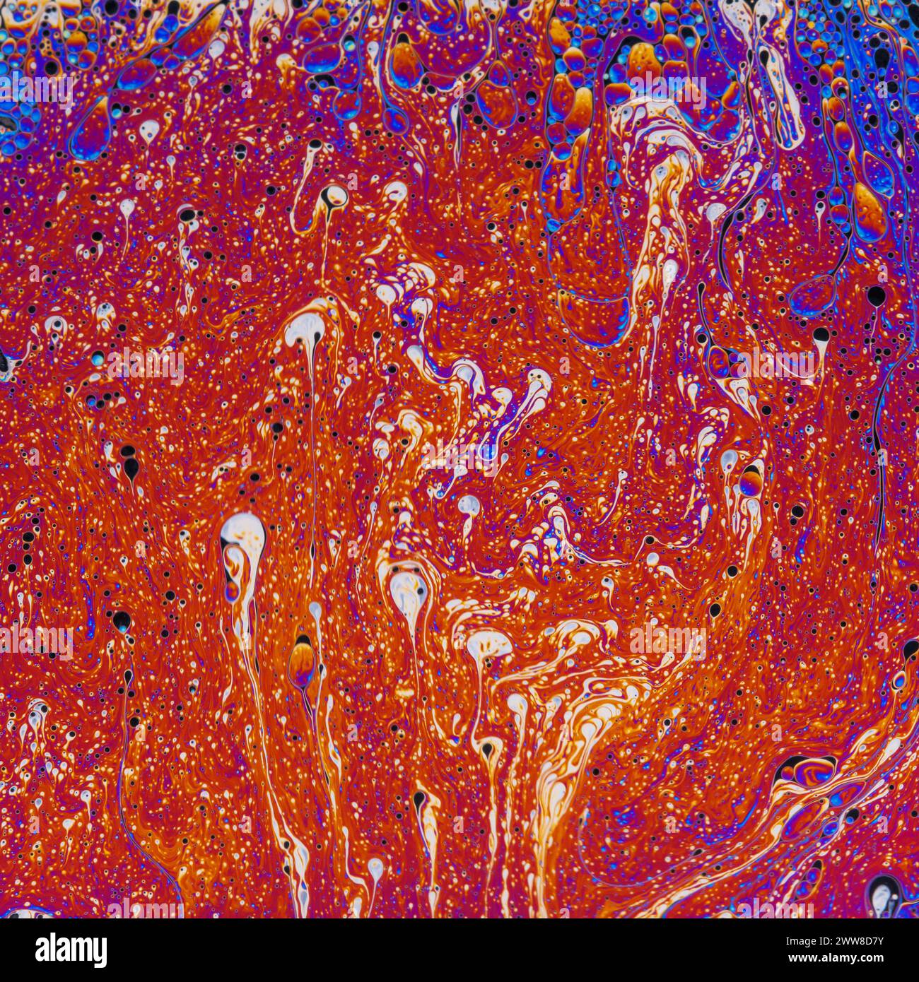 Colorful liquid mixture, blending paints in dynamic abstract fluid ...