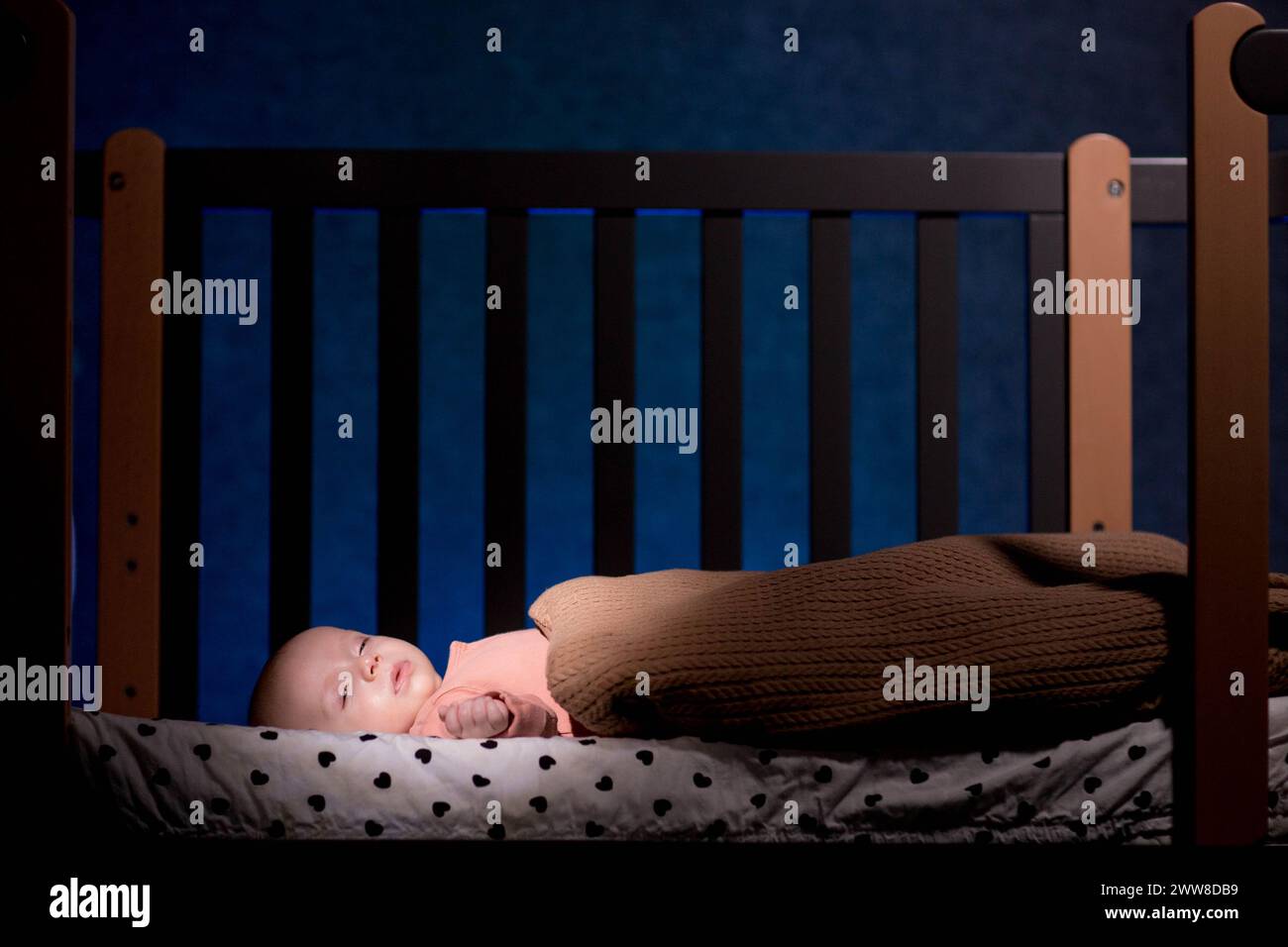 Baby lying in cradle home hi-res stock photography and images - Alamy