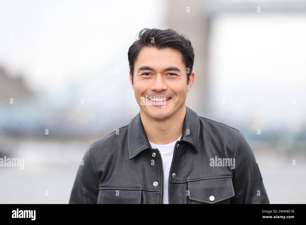 Henry Golding poses for photographers at the photo call for the film ...
