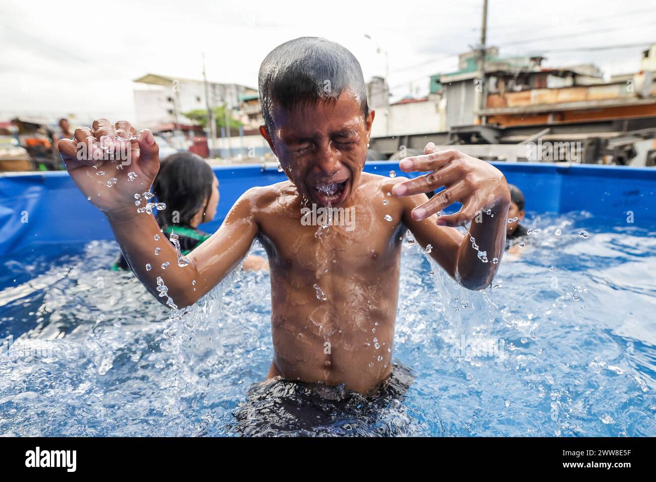 Manila, Philippines. 22nd Mar, 2024. Children have fun in a makeshift ...