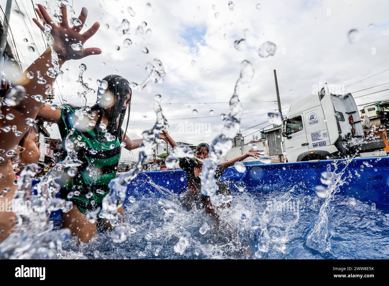Manila, Philippines. 22nd Mar, 2024. Children have fun in a makeshift ...