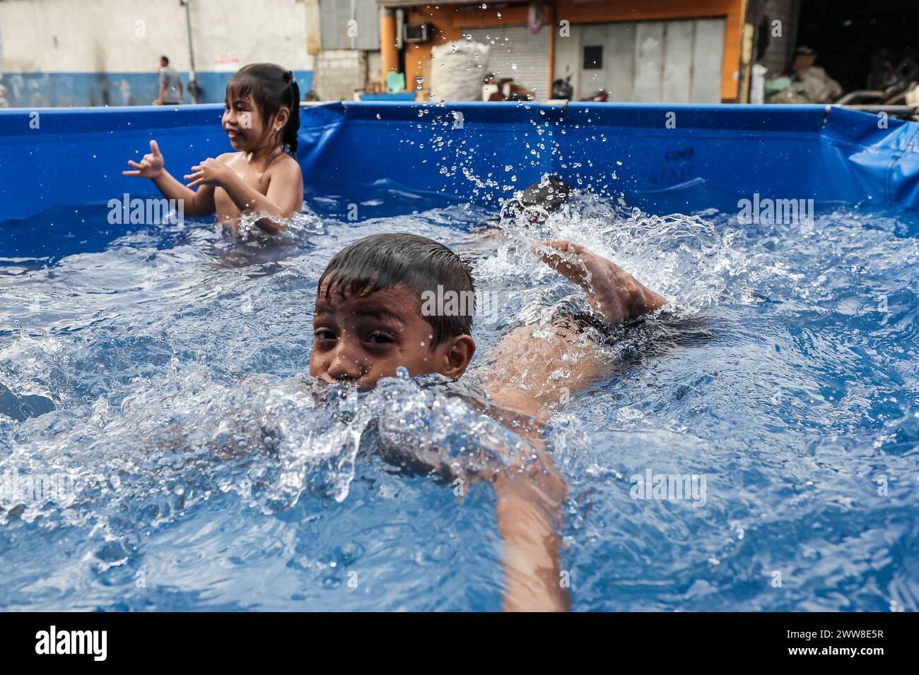 Manila, Philippines. 22nd Mar, 2024. Children have fun in a makeshift ...