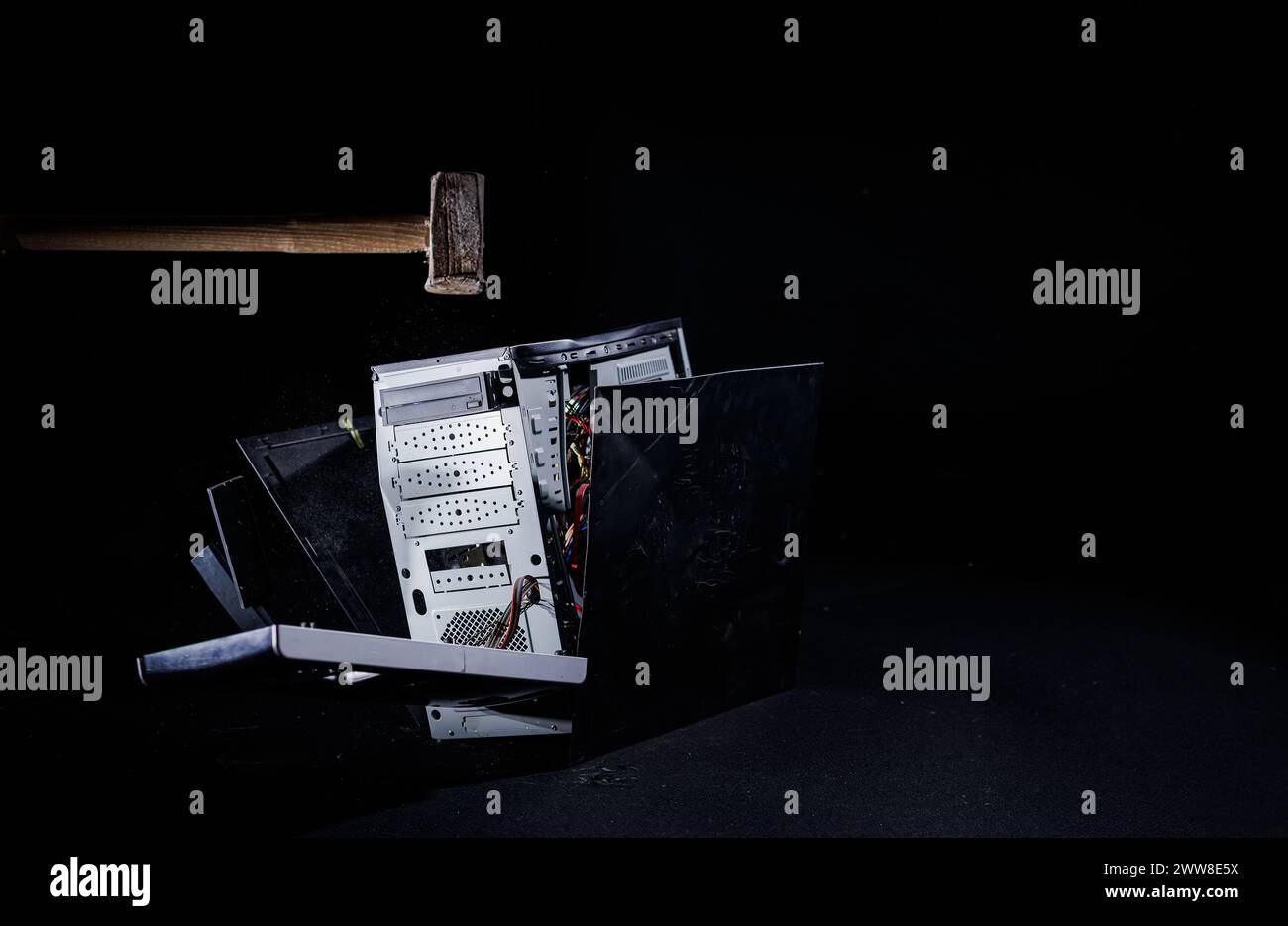 Blow of a large, heavy hammer with a long handle onto a desktop ...