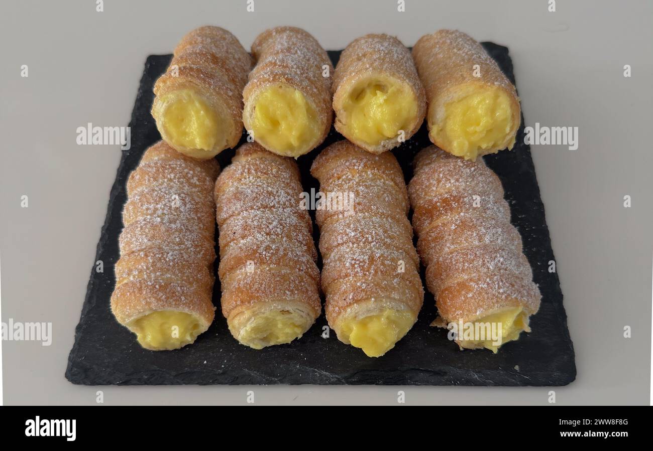 cream puff pastry cannoli - typical Italian festive dessert Stock Photo ...