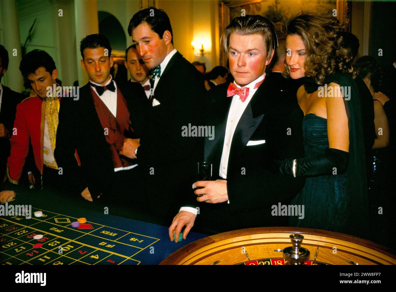Gambling playing roulette at black tie event private Christmas party ...