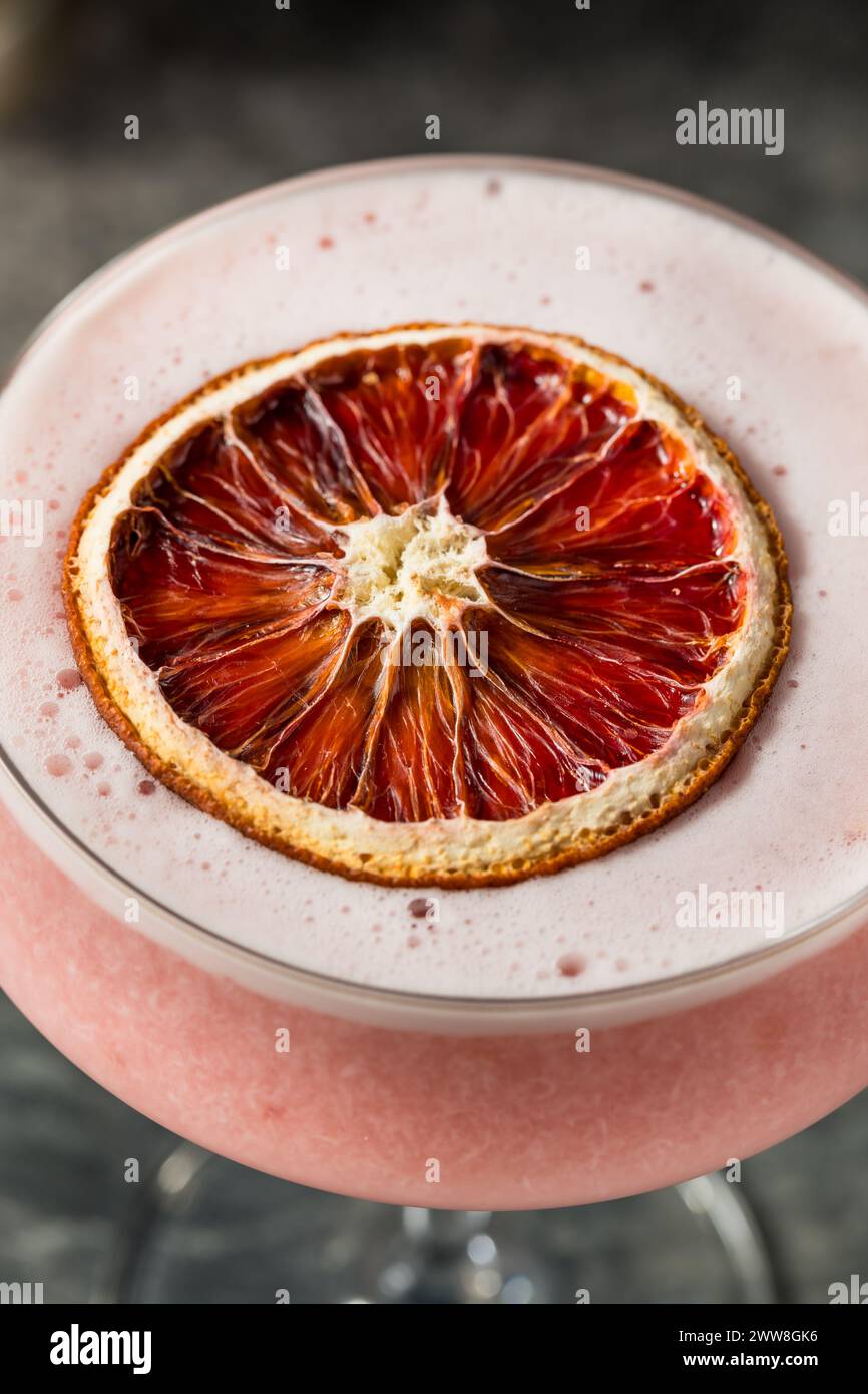 Boozy Foamy Blood Orange Sour Cocktail with Gin Stock Photo - Alamy