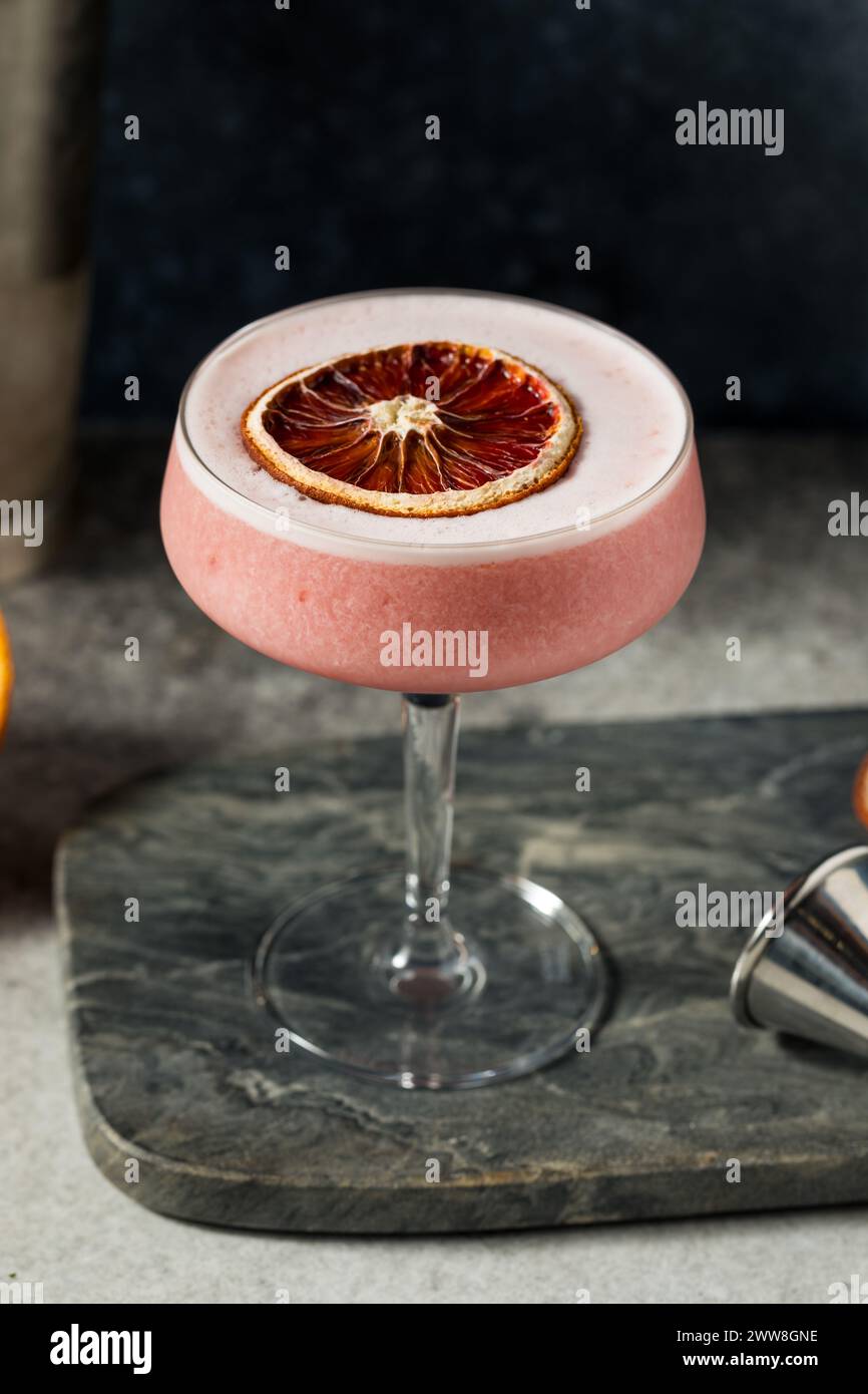 Boozy Foamy Blood Orange Sour Cocktail with Gin Stock Photo - Alamy