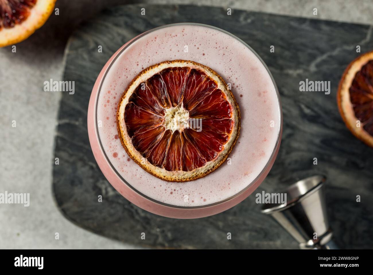 Boozy Foamy Blood Orange Sour Cocktail with Gin Stock Photo - Alamy