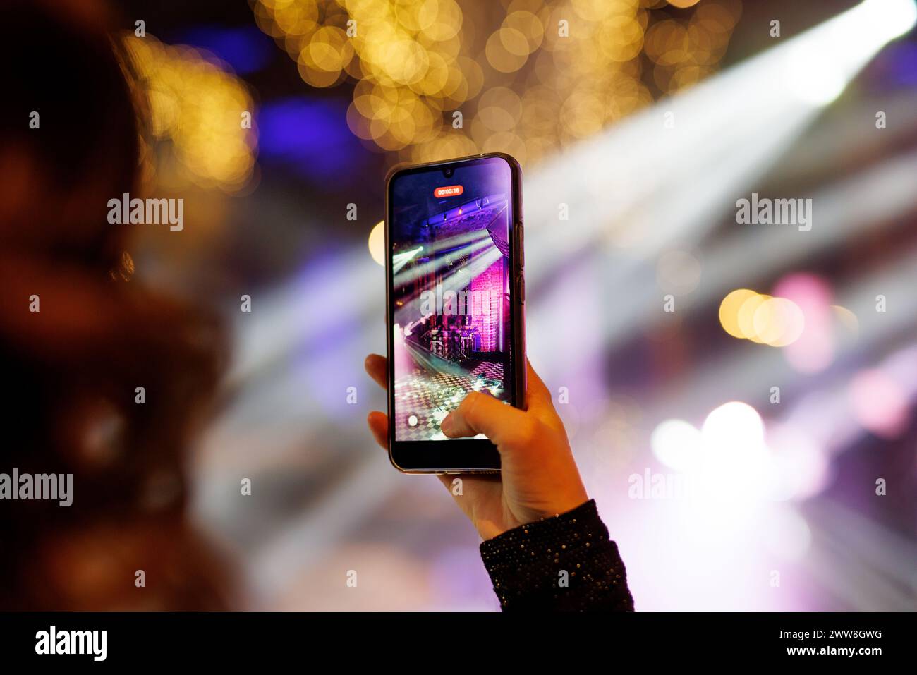 Silhouette of a hand with a mobile phone camera and enjoying the ...