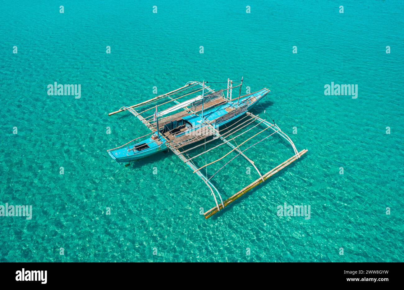 Aerial drone view of traditional philippine boat bangka anchored in the ...