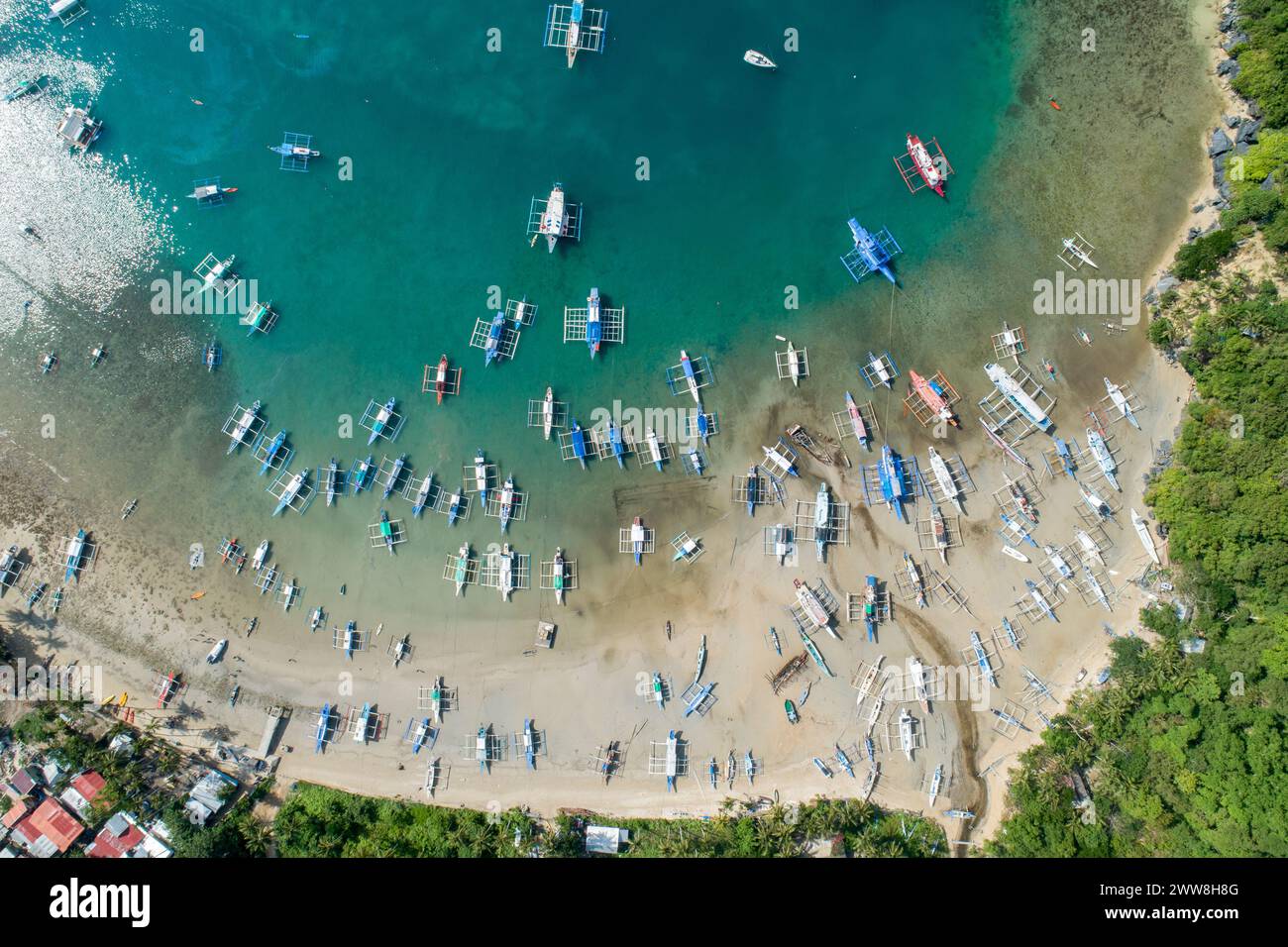 Top drone view of a traditional philippine boats on the surface of the ...