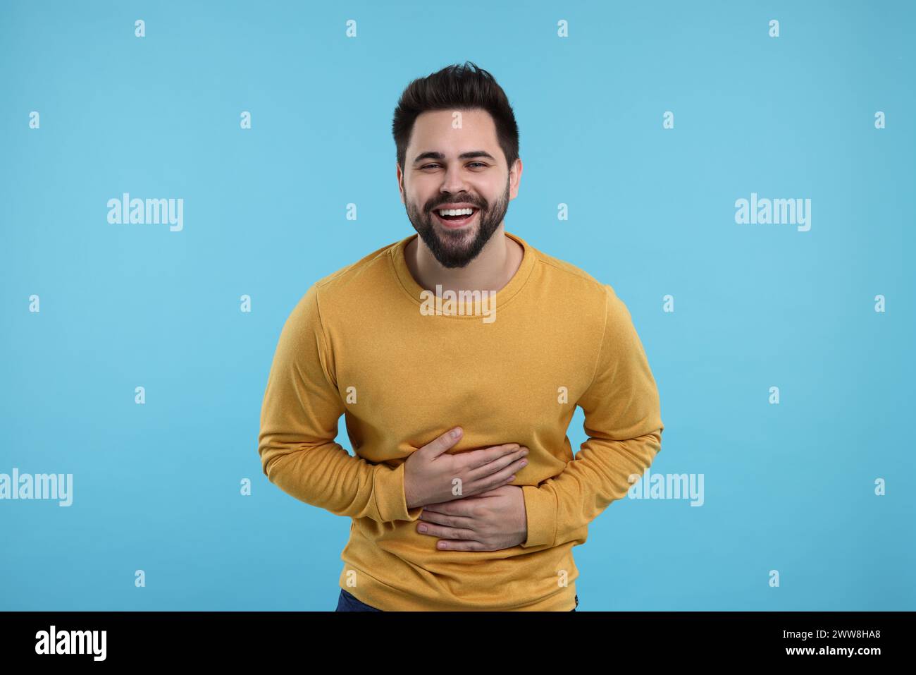 Handsome young man laughing hi-res stock photography and images - Alamy