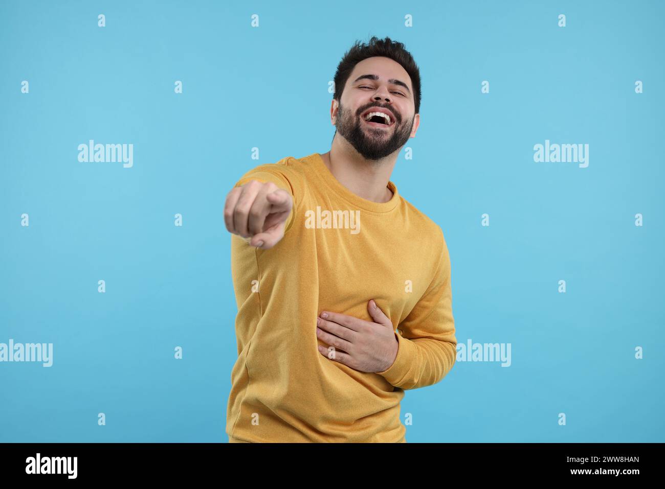 Handsome young man laughing hi-res stock photography and images - Alamy