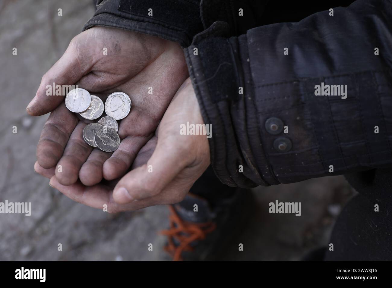 Homeless man counting money hi-res stock photography and images - Alamy