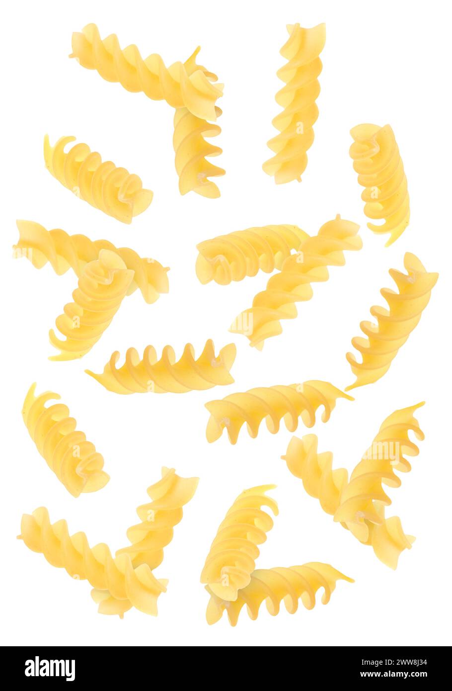 Raw fusilli pasta flying on white background Stock Photo - Alamy