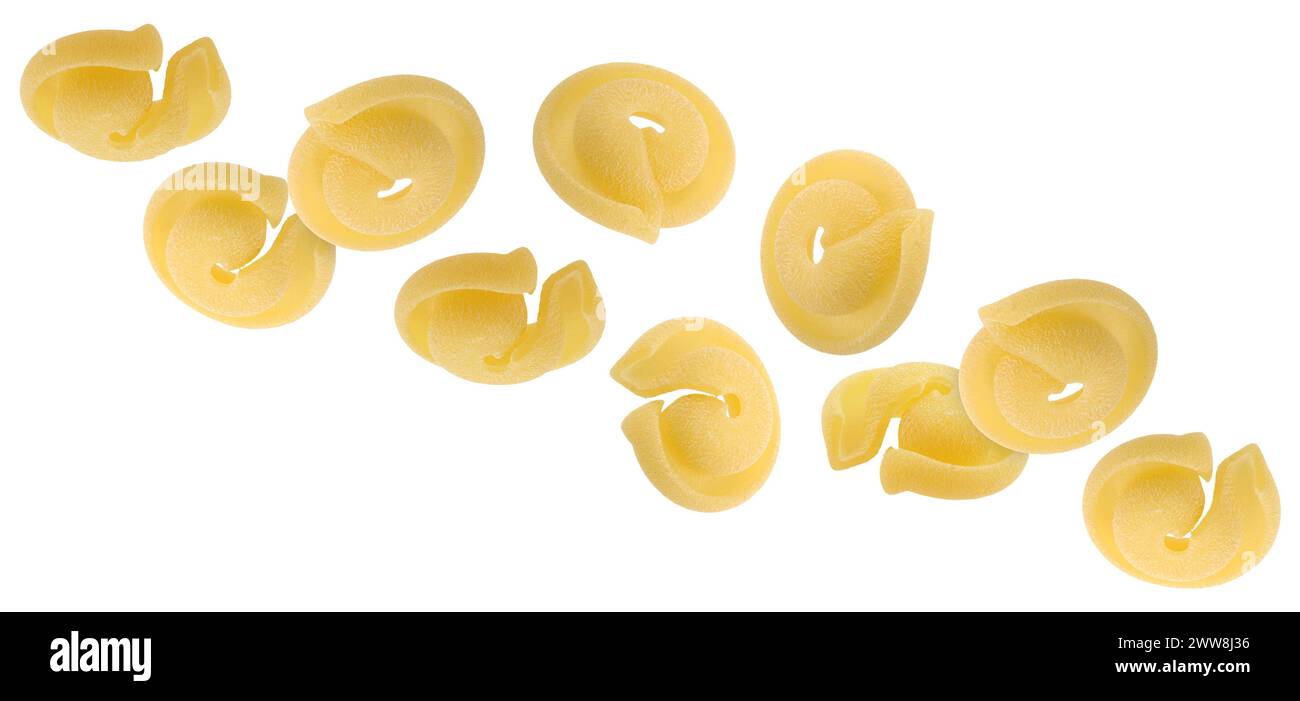 Raw dischi volanti pasta flying on white background Stock Photo - Alamy