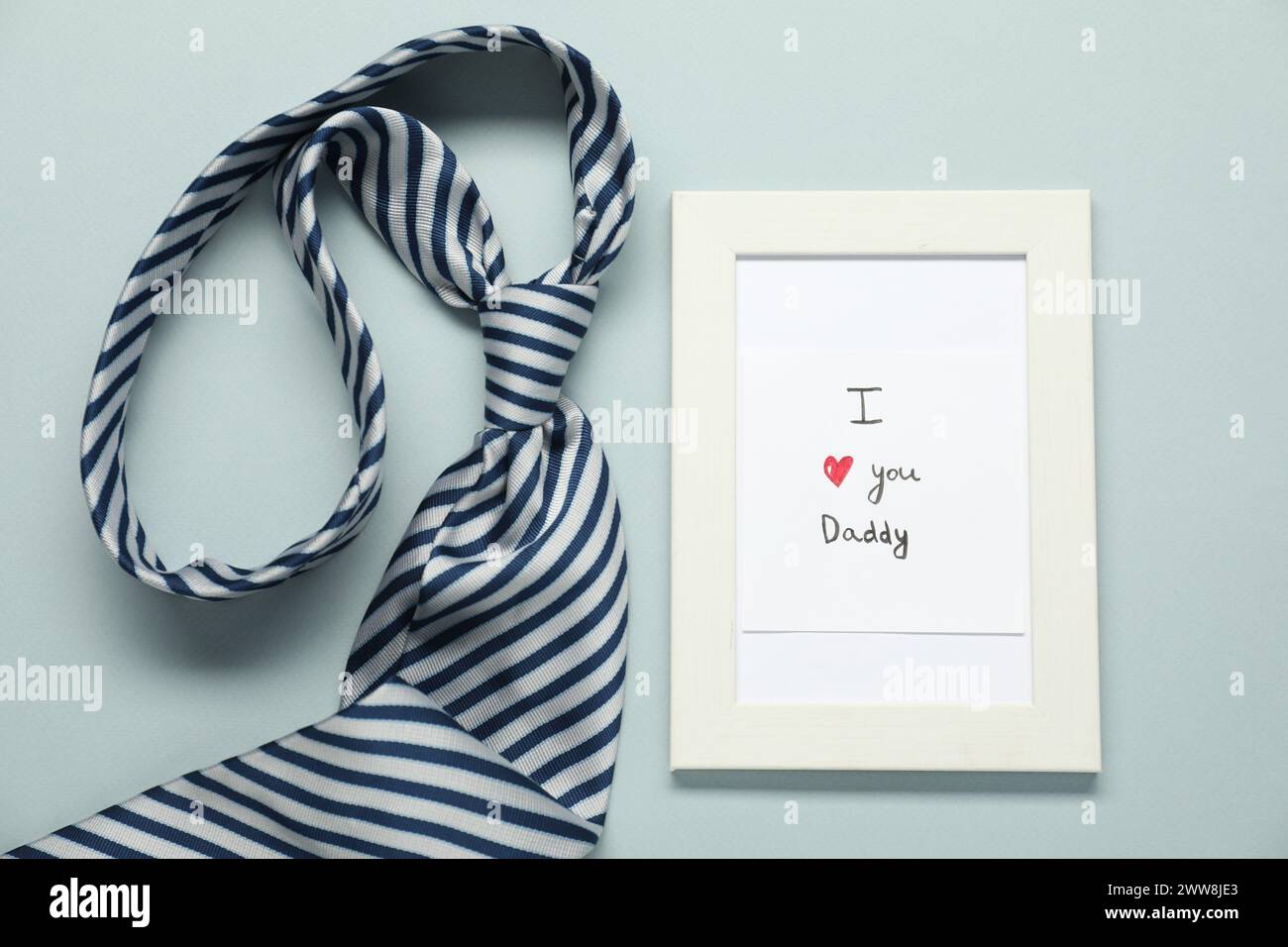 Father's day celebration. Photo frame with phrase I Love You Daddy and ...