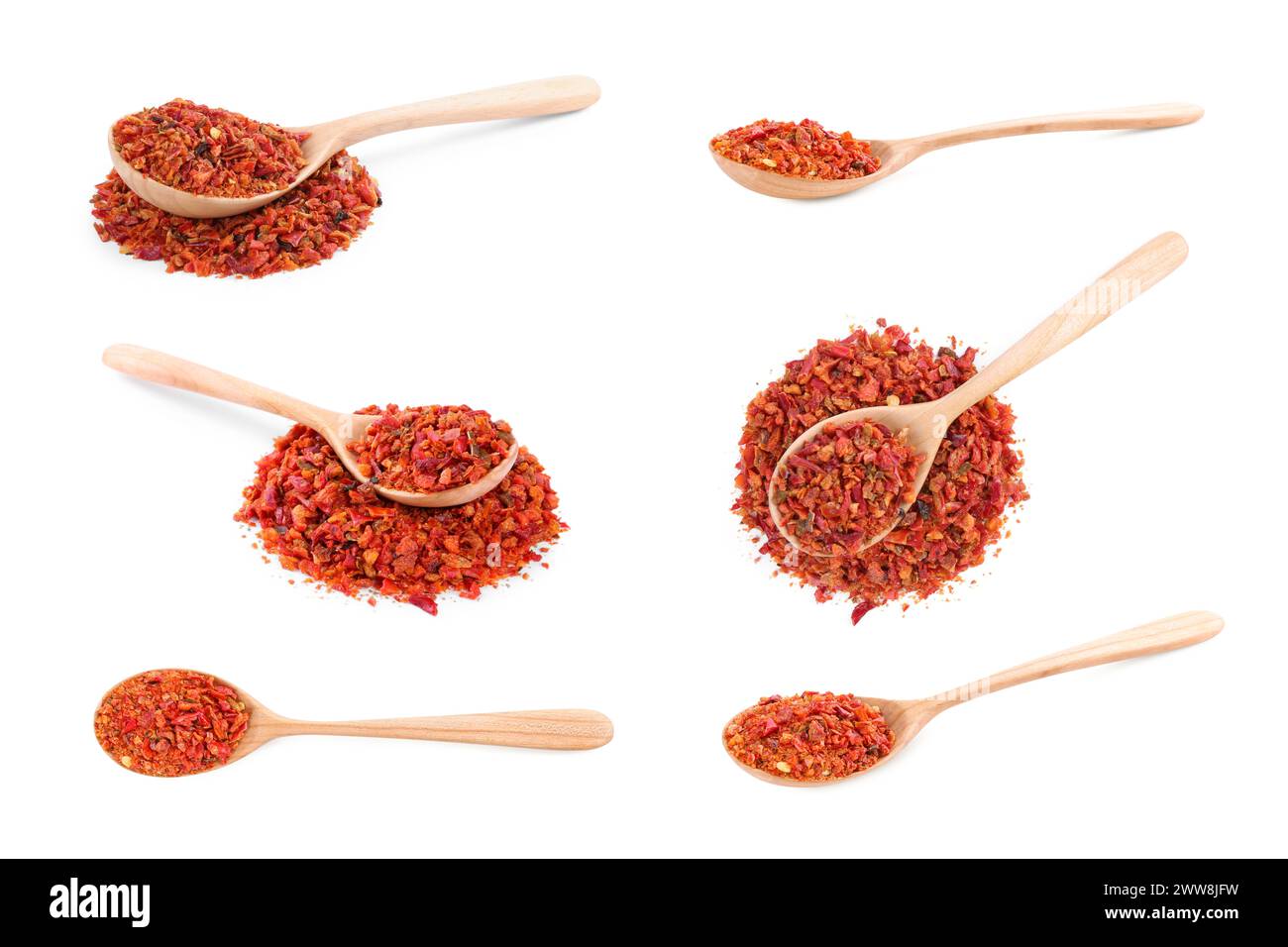 Aromatic spices. Red chili pepper flakes in spoons on white background ...