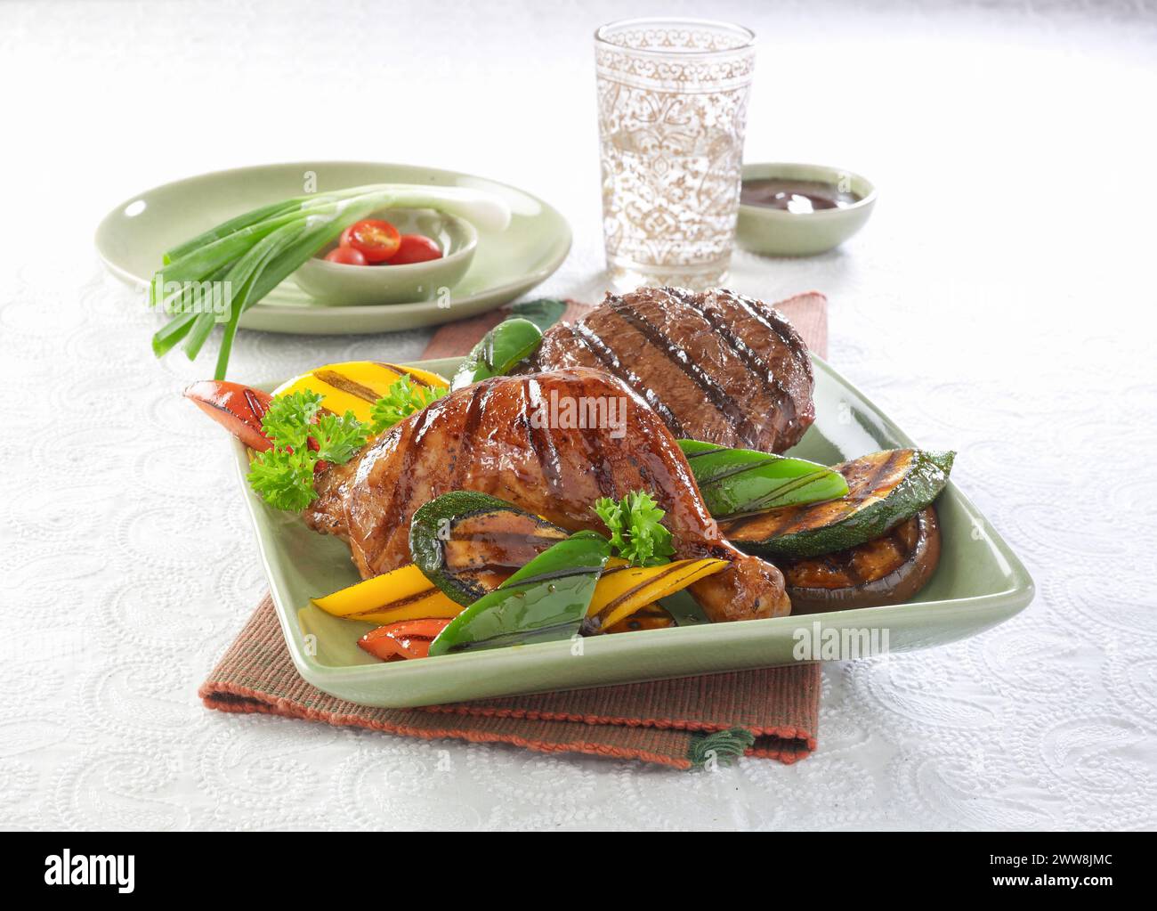 Grilled chicken and grilled burger petty with grilled vegetables Stock ...