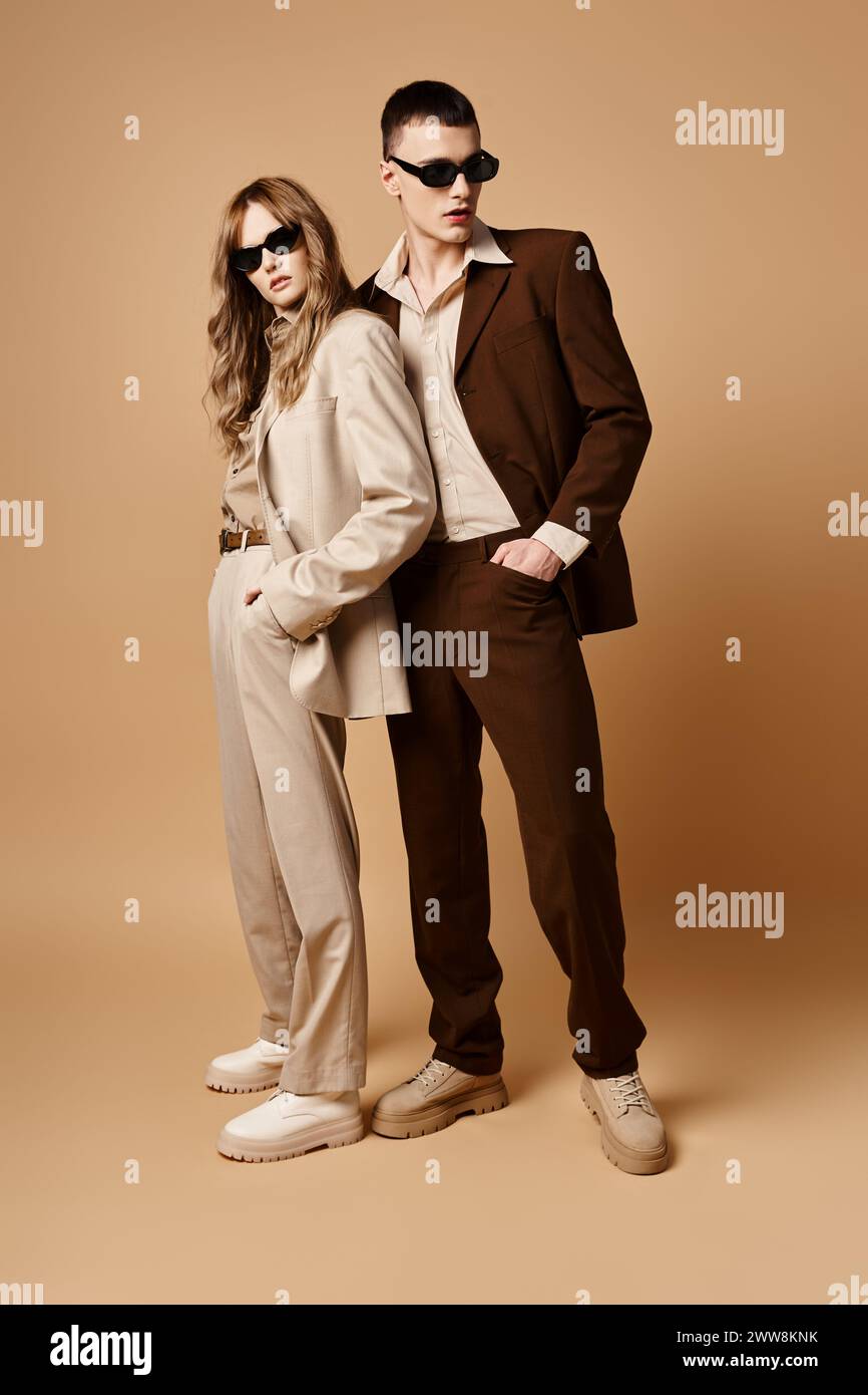 appealing elegant couple in chic seasonal suits with stylish sunglasses ...