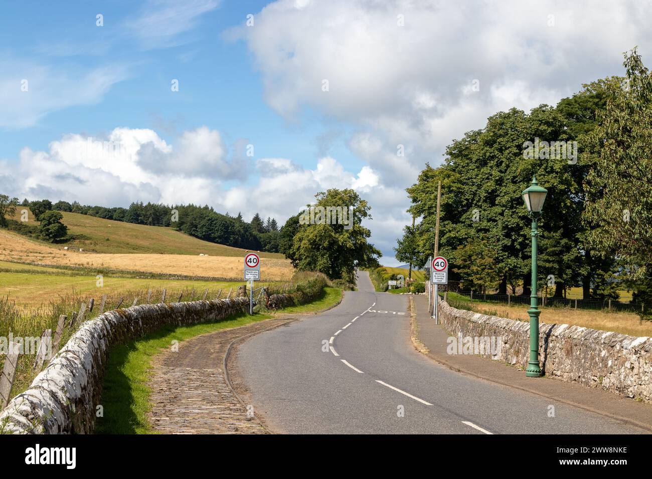 Country road through the Perthshire village of Cleish Stock Photo - Alamy