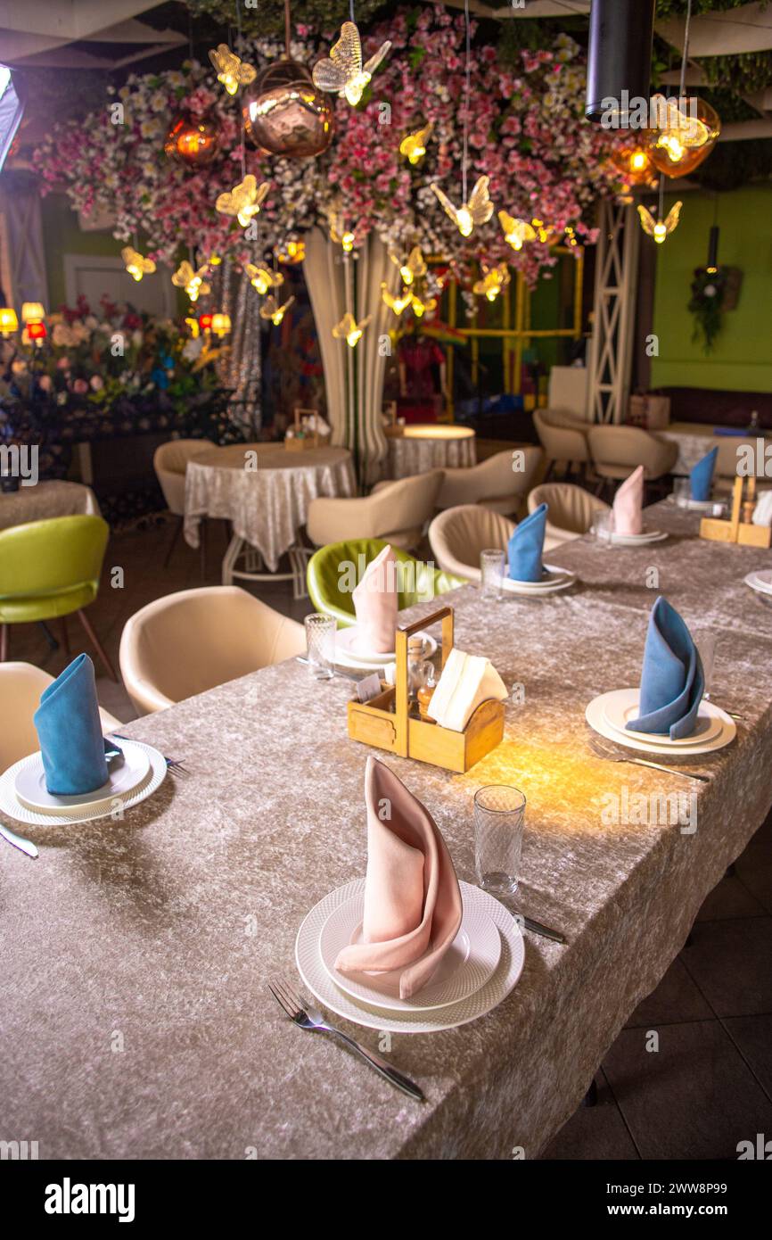 The image shows a beautifully decorated restaurant interior with a ...