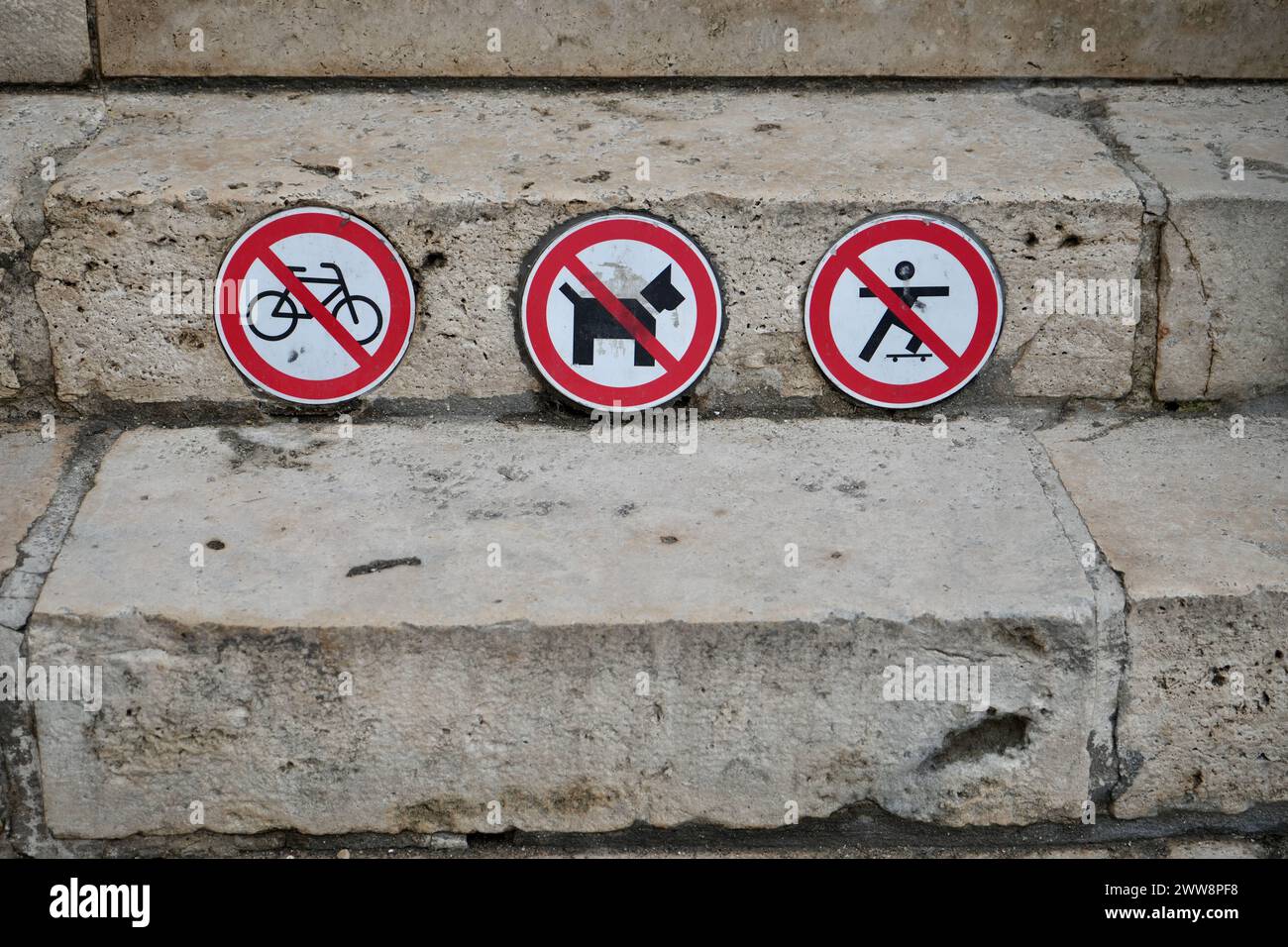 Warning signs on stone steps Stock Photo - Alamy