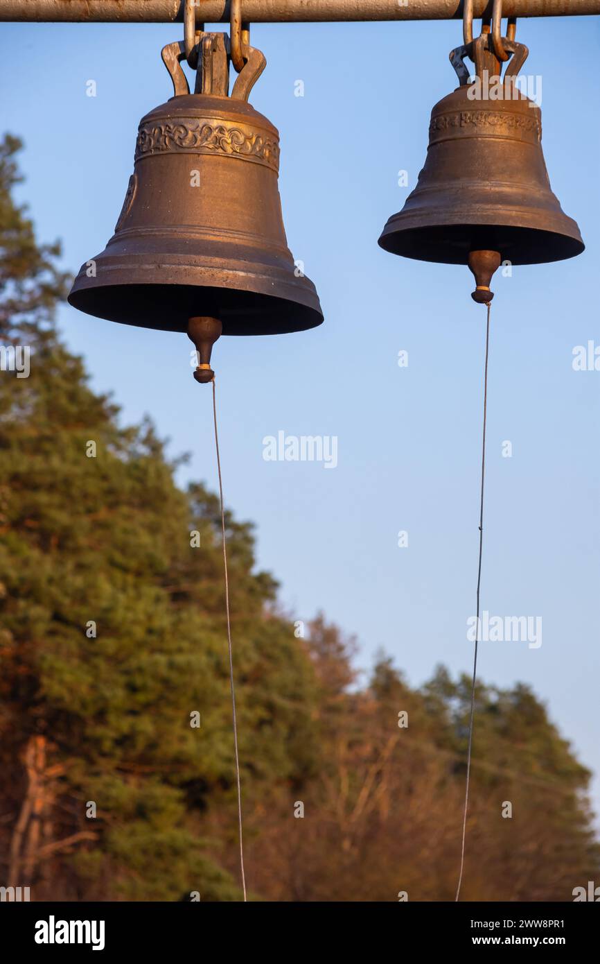 Large Church bell hanging outside. Close-up view of metal orthodox ...