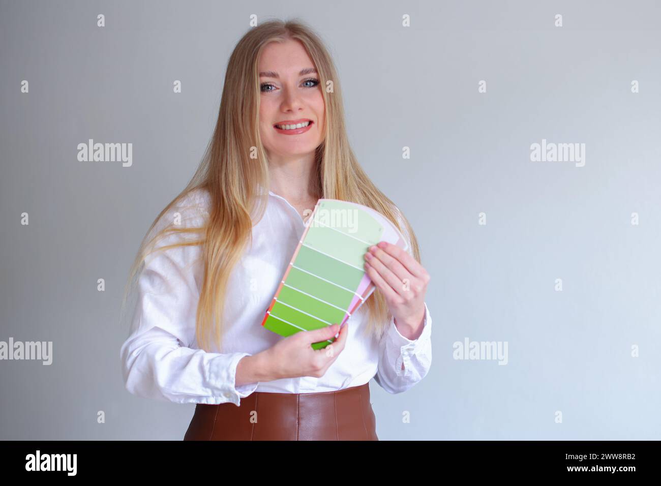 girl interior designer hold color palette Stock Photo - Alamy