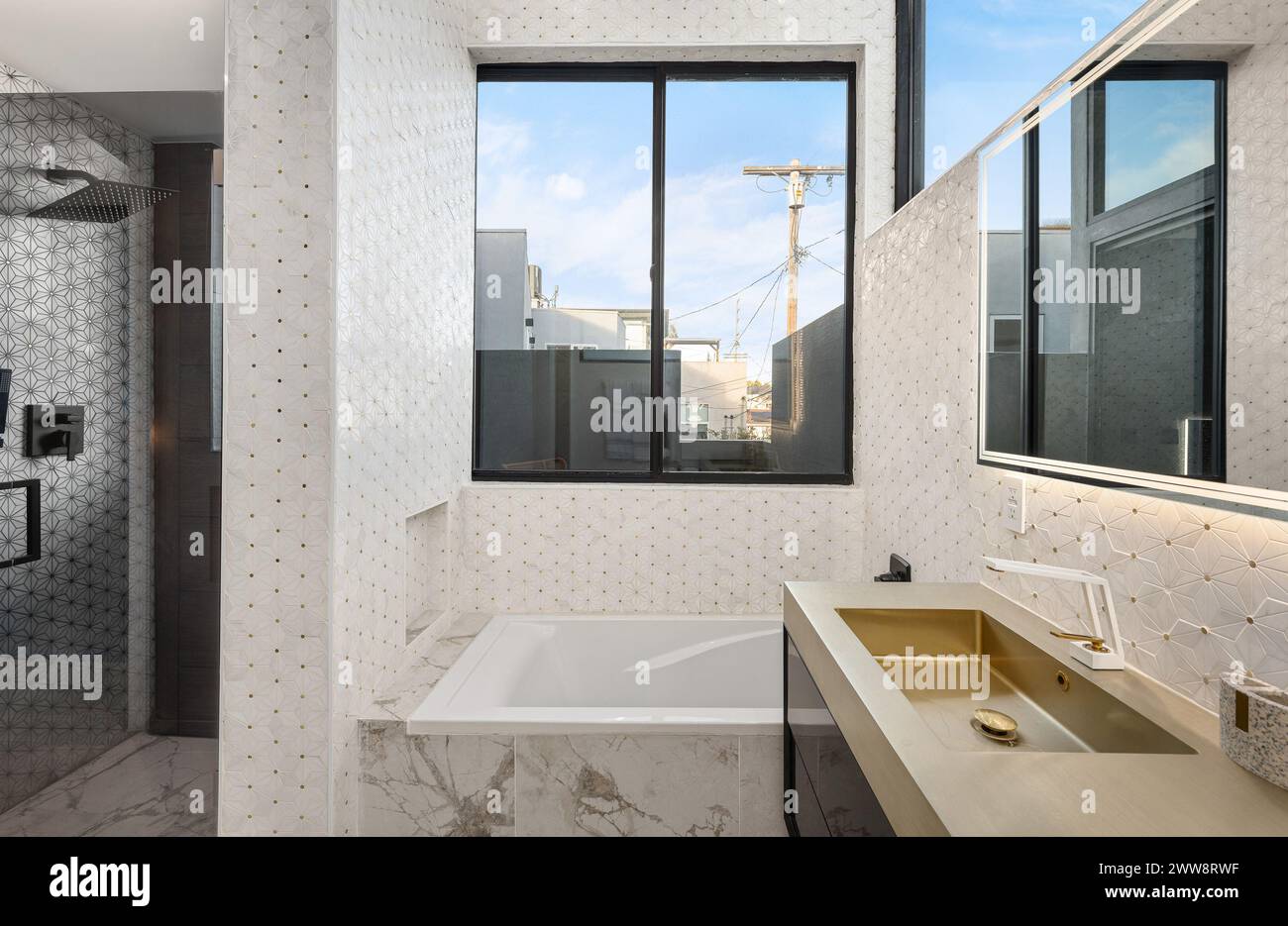 A modern bathroom with contemporary sinks, mirrors, and window Stock ...