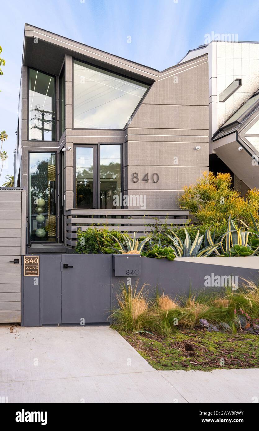A beautiful modern house exterior with lush green plants in Venice ...
