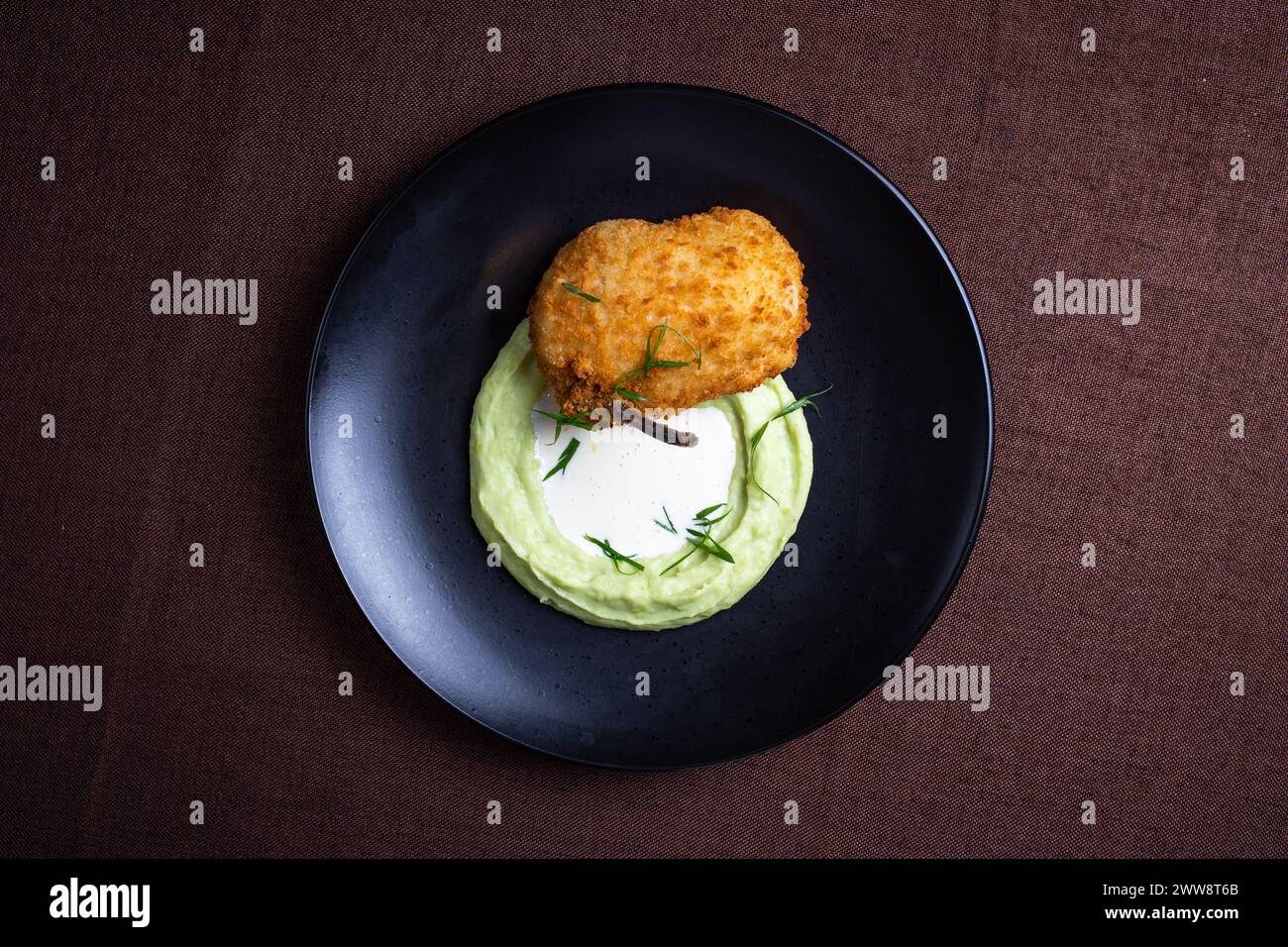 Top view Crispy fried chicken cutlet Kiev style with mashed potatoes on ...