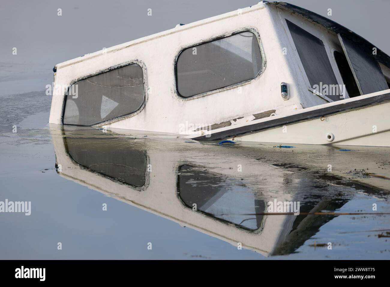 Windows above water line on sunken boat Stock Photo - Alamy