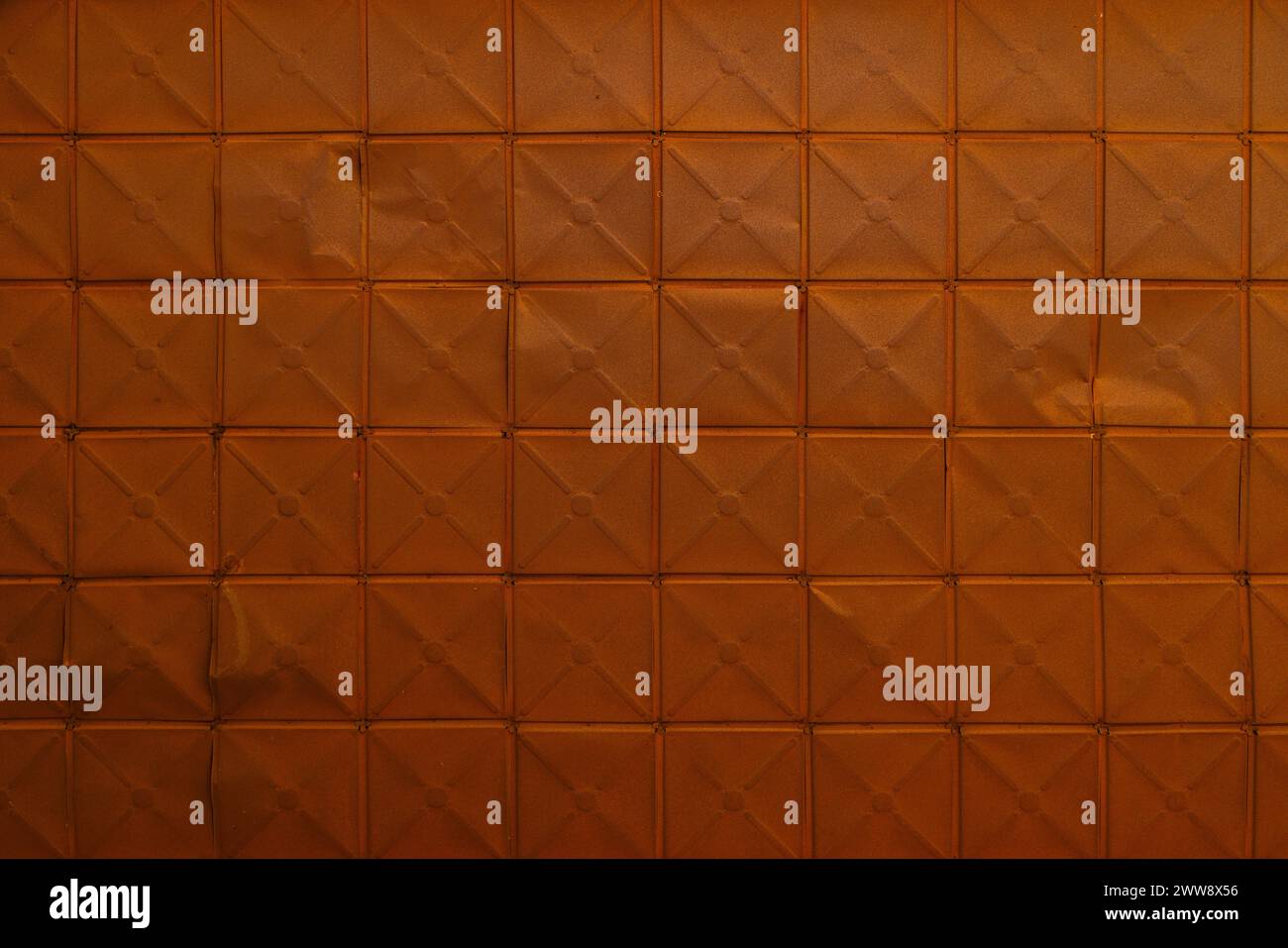 full-frame background and texture of square stamped sheet metal tiles ...