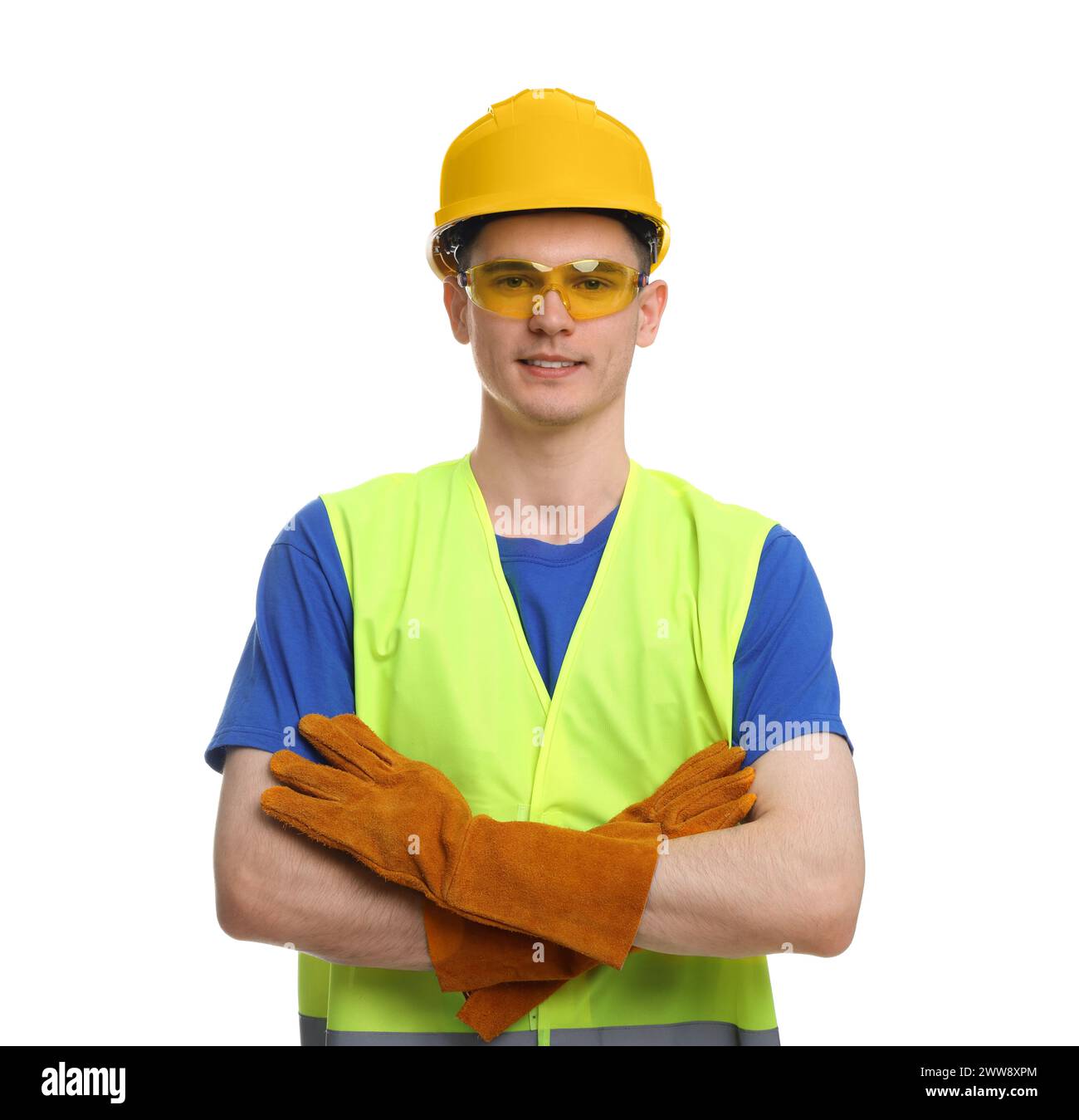 Young man with crossed arms wearing safety equipment on white ...