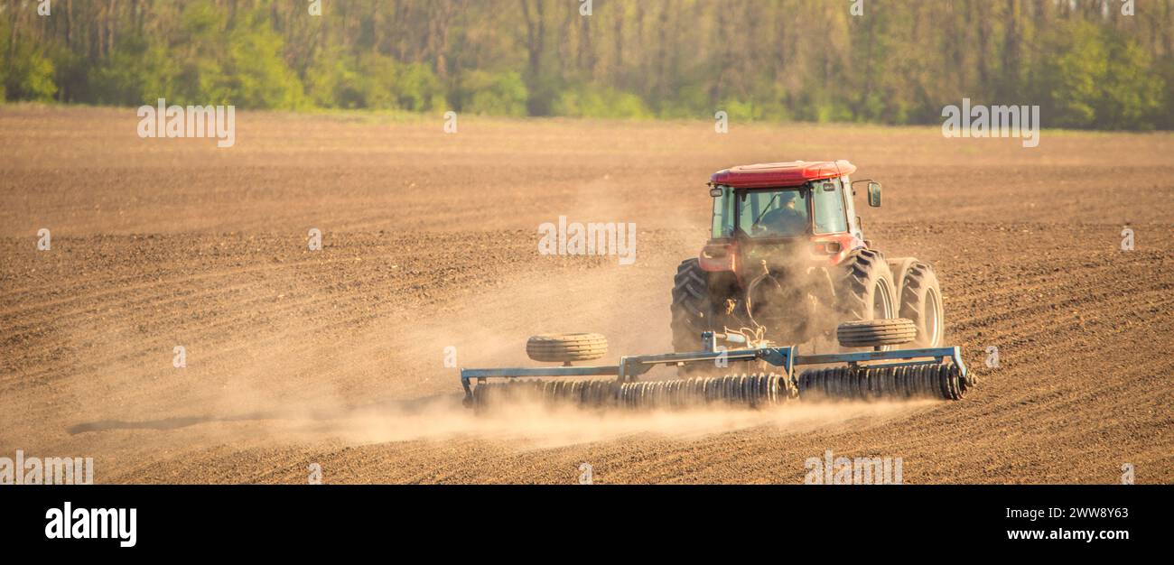 Tillage Tango: Tractor Tilling the Soil Stock Photo - Alamy