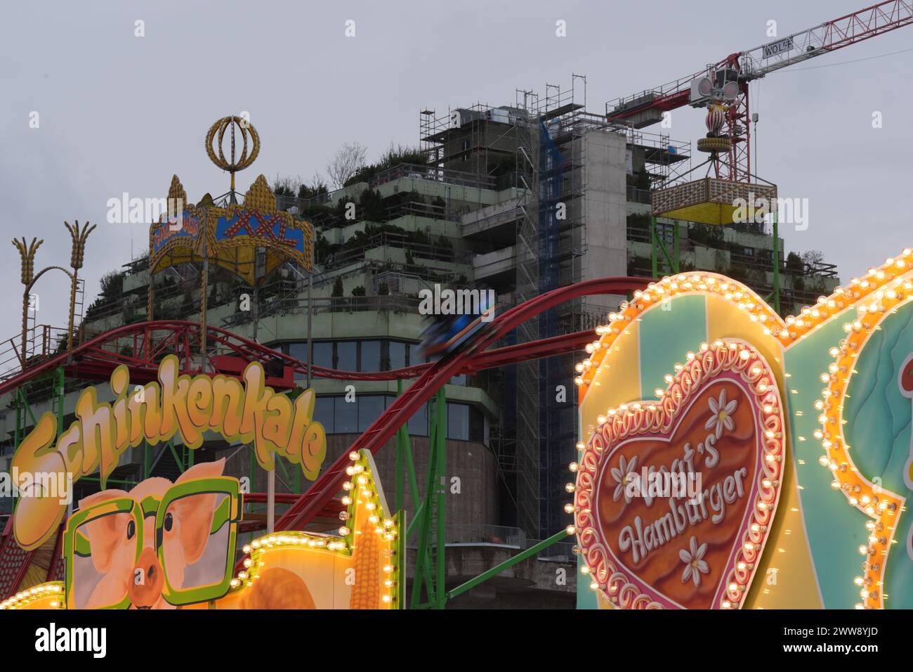 Hamburg, Germany. 22nd Mar, 2024. Visitors ride a ride on the ...