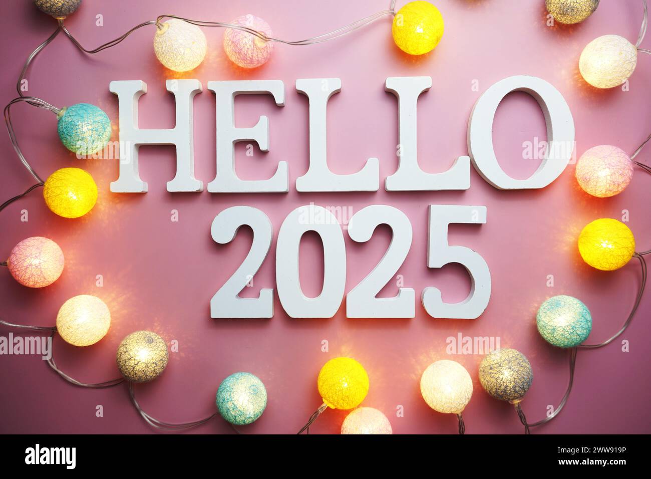 Hello 2025 alphabet letter with cotton ball LED decoration on pink ...
