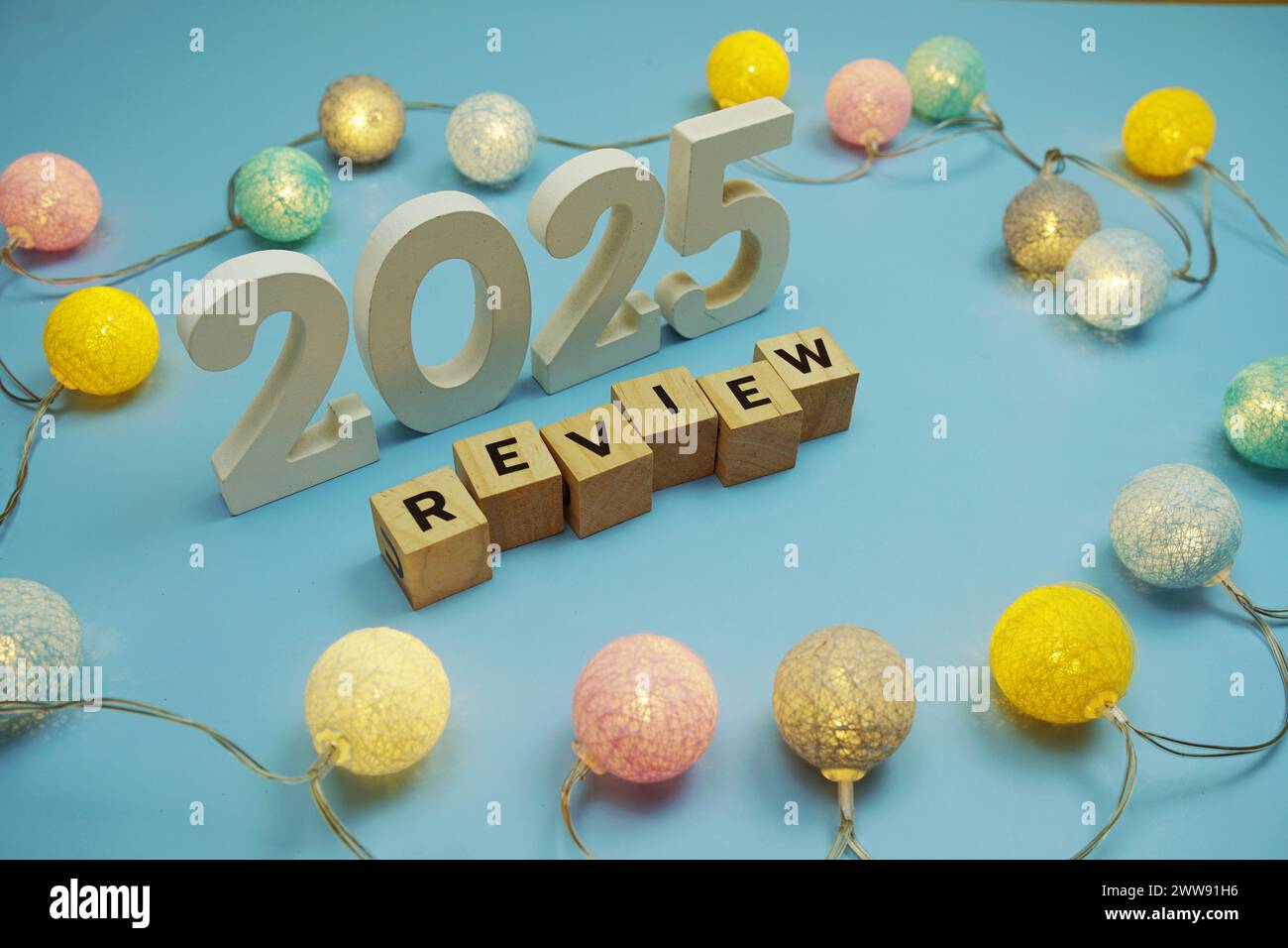 Review 2025 letters with LED cotton balls decoration on blue background ...