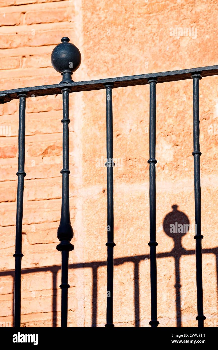 Handrail ball on railing with its shadow in San Carlos del valle Stock ...