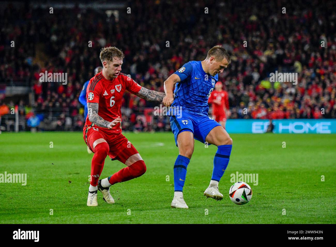 Cardiff, Wales. 21 March 2024. Robin Lod of Finland (right) holds off ...