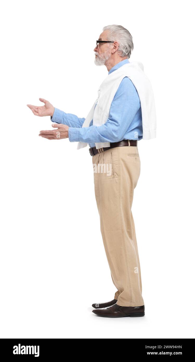 Senior man greeting someone on white background Stock Photo - Alamy