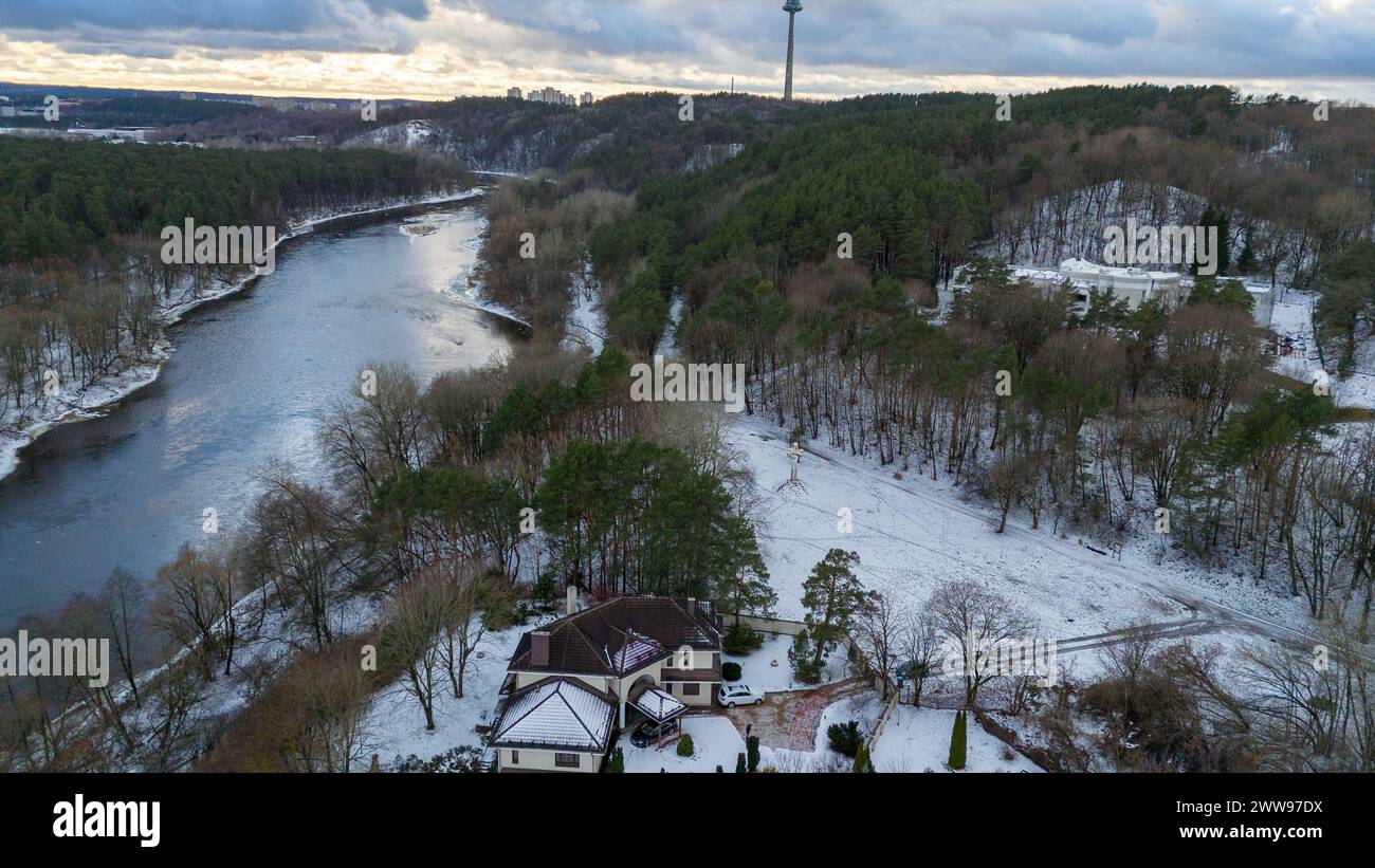 Drone photography of river flowing through park , forest and cityscape ...