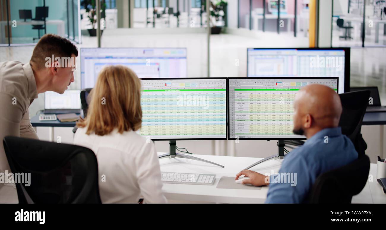 Analyst Employee Working On Spreadsheet Using Desktop Computer Stock ...