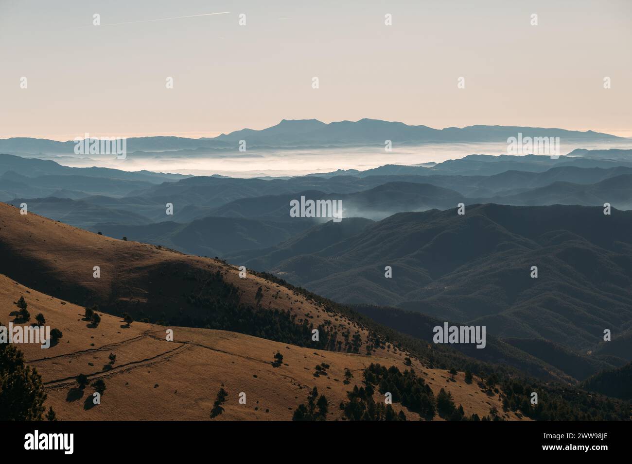 Shadowy Mountain Slopes Leading into Misty Valleys at Dawn Stock Photo ...