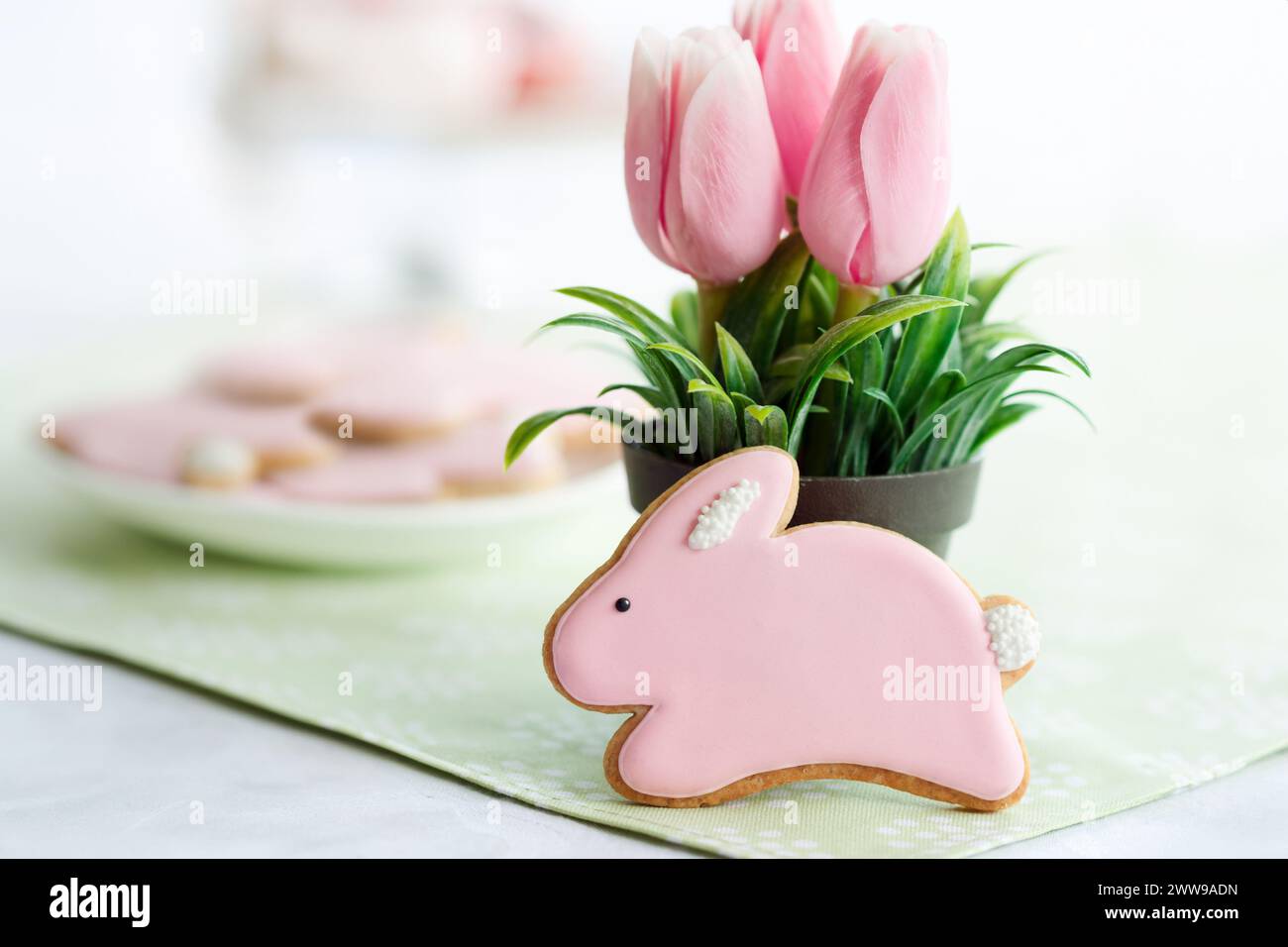 Easter bunny cookie with pink icing Stock Photo - Alamy