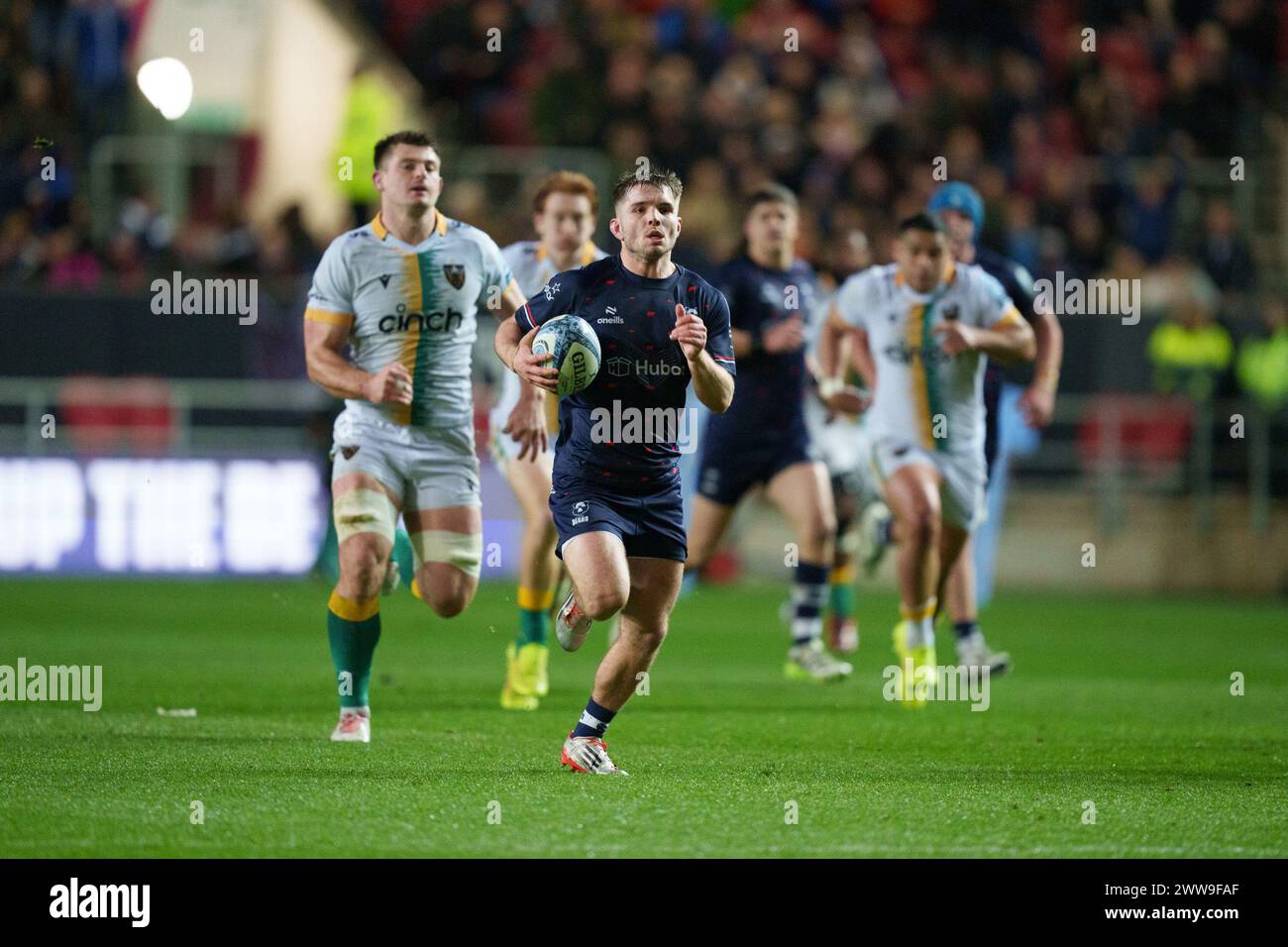 Harry Randall of Bristol Bears runds half the length of the pitch and ...